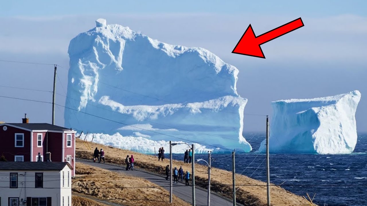 Enigmatic Iceberg Drifts Dangerously Close to Local Village, Unveiling ...